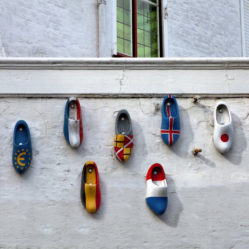Wooden Sabots with the Image of Flags of the World on a White Wa Stock ...