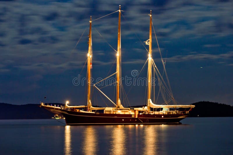 Wooden Sailboat Illuminated at Night Stock Image - Image of sail ...