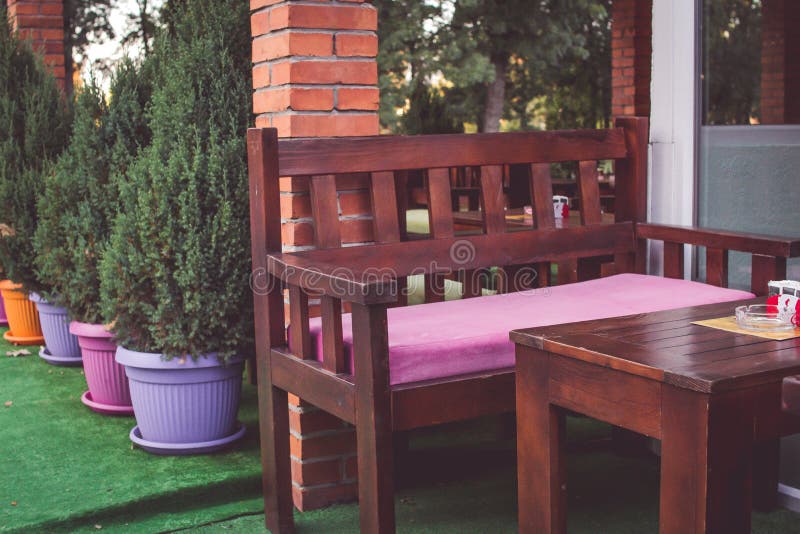 Wooden Seat and a Wooden Table with Flower Pots Stock Photo - Image of ...