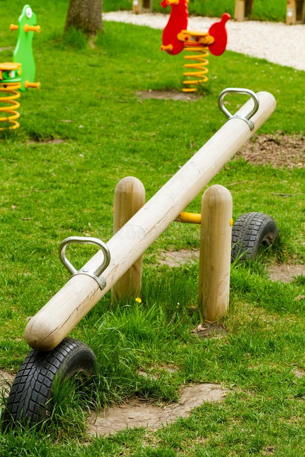 Wooden see-saw stock image. Image of grass, back, outdoor - 27169925