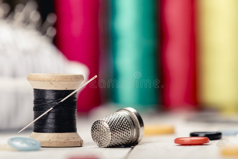 Wooden Sewing Spool with Black Thread and Metal Thimble Stock Photo ...