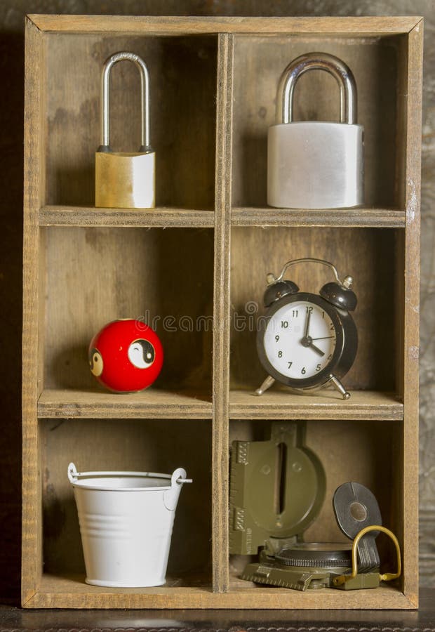 Wooden Shelf and Clock, Lock, Compass, Bucket Stock Photo - Image of ...