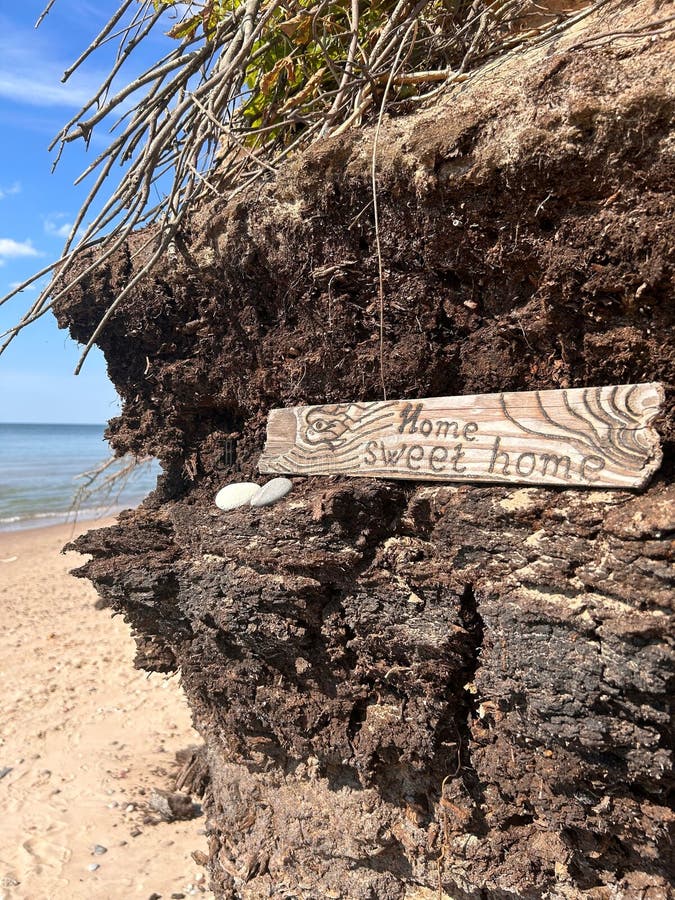 Wooden Sign in a Beach Setting with Text: Home Sweet Home Stock Photo ...