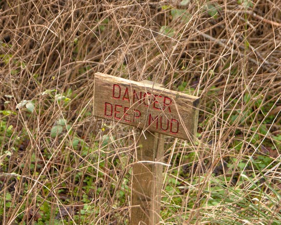 Wooden Sign Danger Deep Mud Stock Photo - Image of sign, grass: 64290802