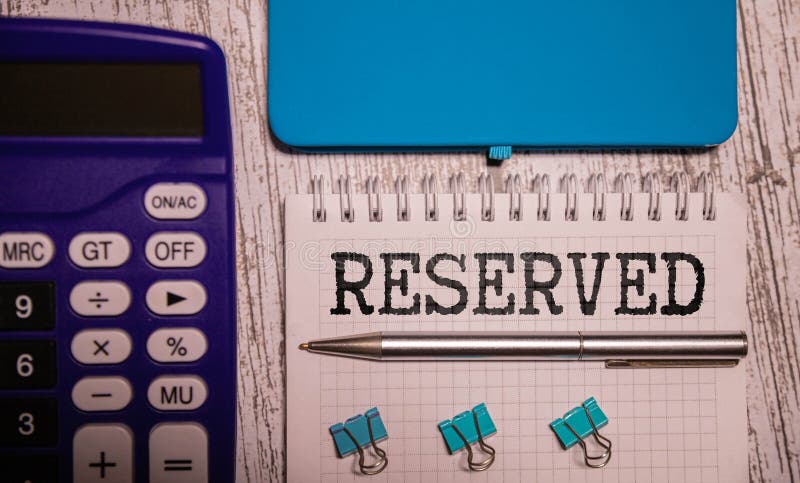 A Wooden Sign that Says Reserved is on a Table. the Sign is Placed in ...
