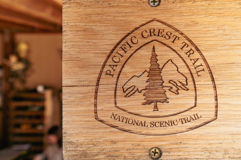 A Wooden Sign with a Tree on it that Says Pacific Crest Trail Editorial ...