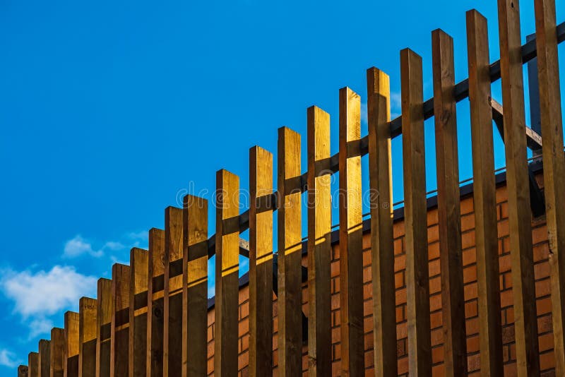 Wooden Slats Protect the Building from Sunlight. Wooden Facade and Blue ...
