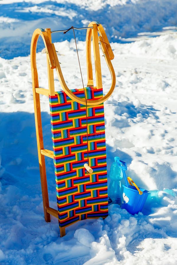 Wooden Sledge in the Snow. on Blue and White Background. Stock Image ...