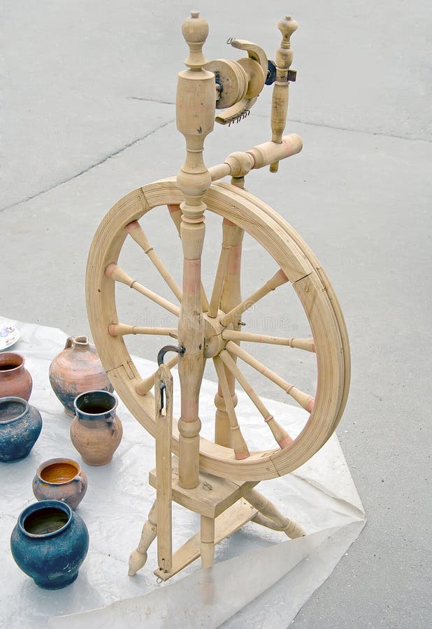 Wooden Spinning Wheels and Old Jugs Stock Photo - Image of common ...