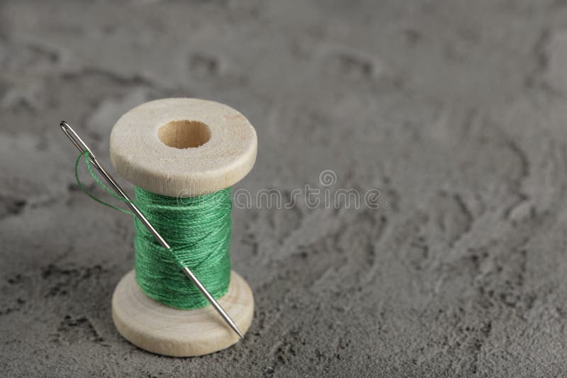 Wooden Spool with Green Thread and Sharp Needle Stock Image - Image of ...