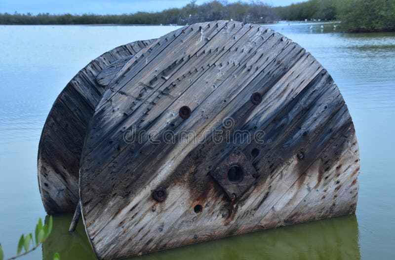 Wooden Spool in Shallow Ocean Waters Stock Photo - Image of outdoors ...