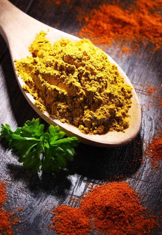Wooden Spoon with Curry Powder on Kitchen Table Stock Photo - Image of ...