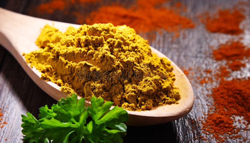 Wooden Spoon with Curry Powder on Kitchen Table Stock Image - Image of ...