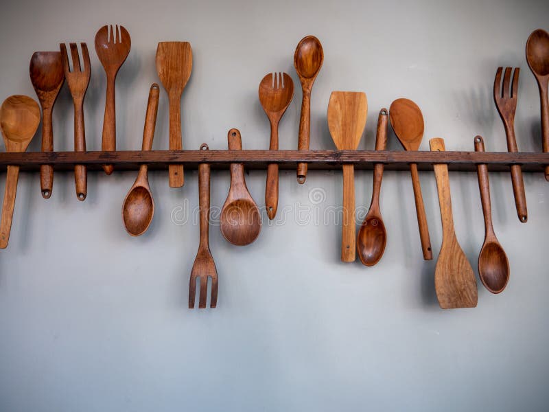Wooden Spoon Fork and Ldle Hanging on the Wooden Rail Stock Image ...