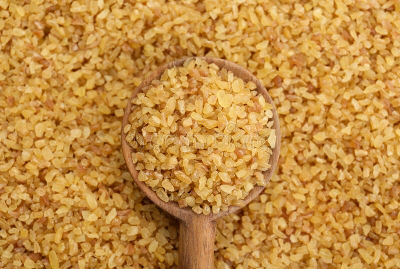 Wooden Spoon on Pile of Uncooked Bulgur, Top View Stock Photo - Image ...