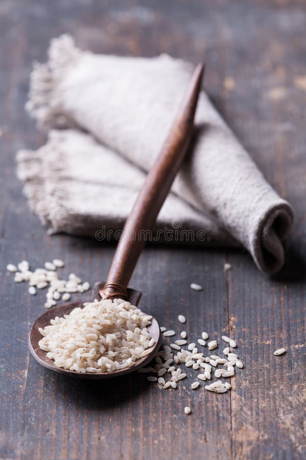 Wooden spoon with rice stock photo. Image of food, ingredient - 35799412
