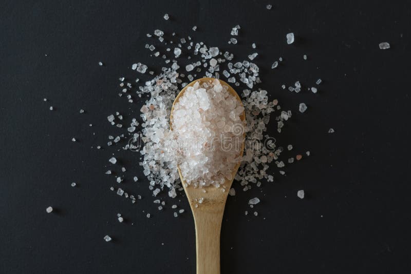 Wooden Spoon with Sea Salt on the Table, Top View Isolated Stock Photo ...