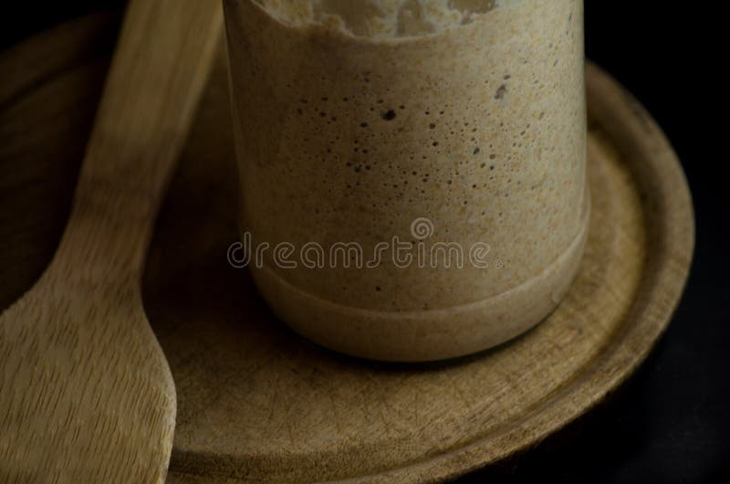 Wooden Spoon and Sourdough Starter in a Glass Jar Stock Photo - Image ...