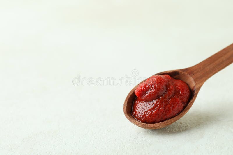 Wooden Spoon with Tomato Paste on White Textured Background Stock Image ...