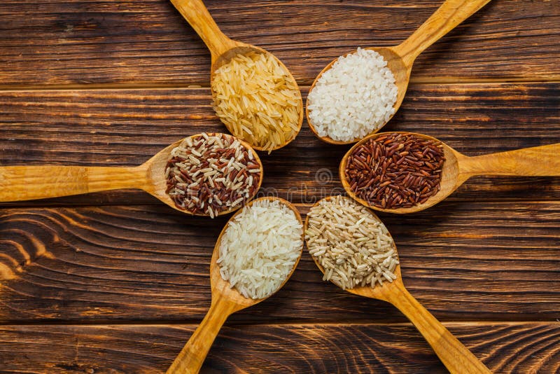 Wooden Spoons With Different Rice Types On The Wooden Background Stock ... Wooden Spoons With Different Rice Types On The Wooden Background Stock ...