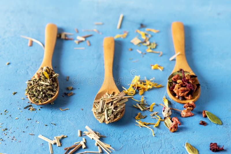 Wooden Spoons with Different Teas on Blue Background Horizontal Stock ...