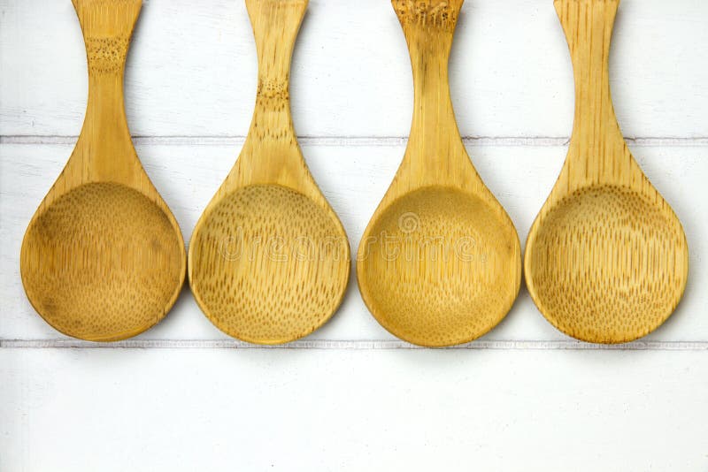 Wooden spoons on row stock image. Image of surface, natural - 35479649