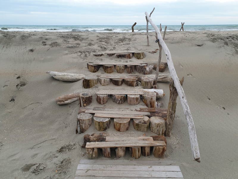 Wooden stairs on the beach stock photo. Image of homemade - 189397128