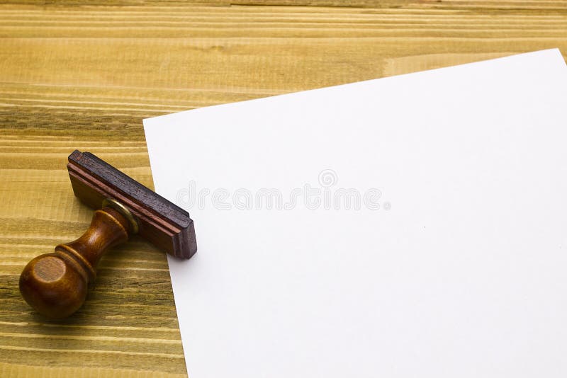 Wooden Stamp and a Sheet of Paper Stock Image - Image of focus ...