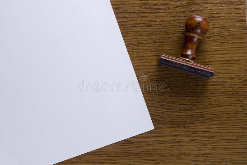Wooden Stamp and a Sheet of Paper Stock Photo - Image of approval ...