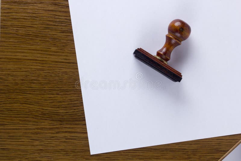 Wooden Stamp and a Sheet of Paper Stock Photo - Image of business ...
