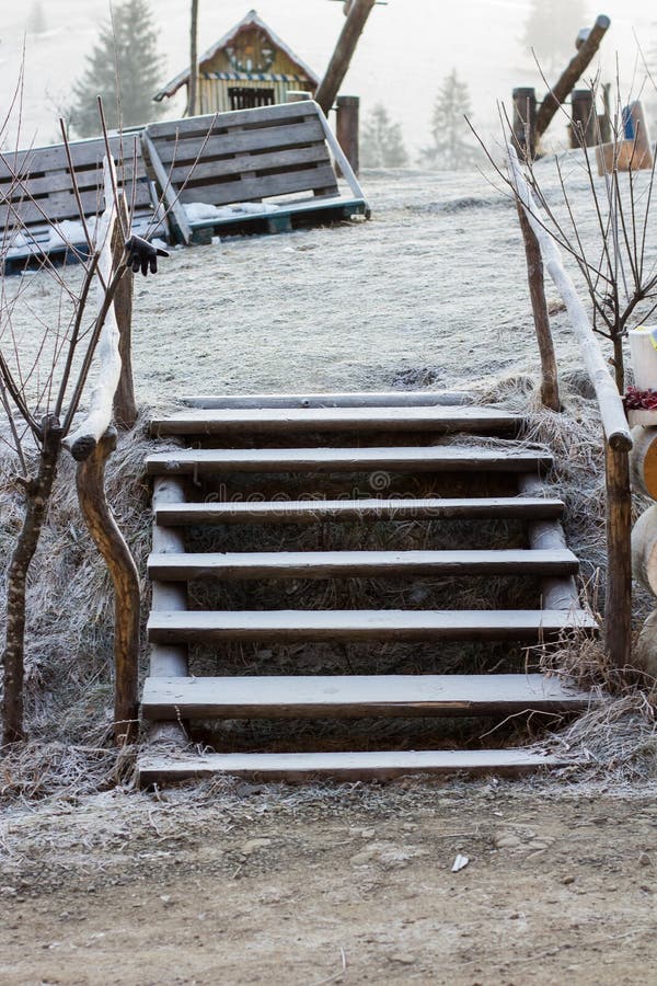 Wooden steps in the snow stock photo. Image of slippery - 134680806
