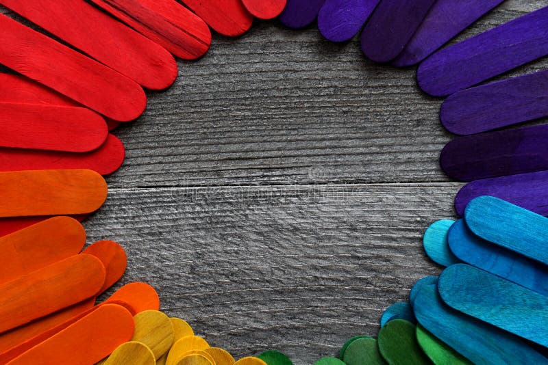 Wooden Sticks Painted in Different Colors on a Wooden Table Stock Photo ...