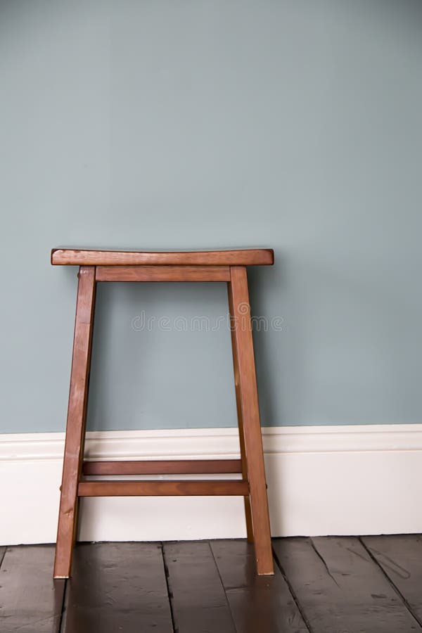 Wooden Stool in Front of a Blue Wall Stock Image - Image of white, blue ...