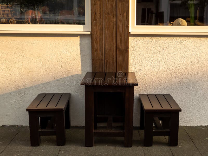 Wooden stools and table. stock photo. Image of style - 250650106