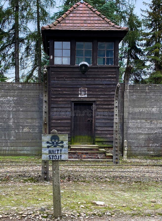 Wooden Stop Danger Sign in Front of a Guard Tower at the Auschwitz ...