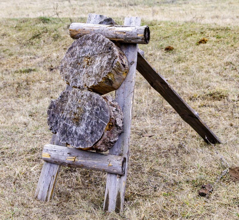 A Wooden Structure with Two Large Logs on Top of it Stock Photo - Image ...