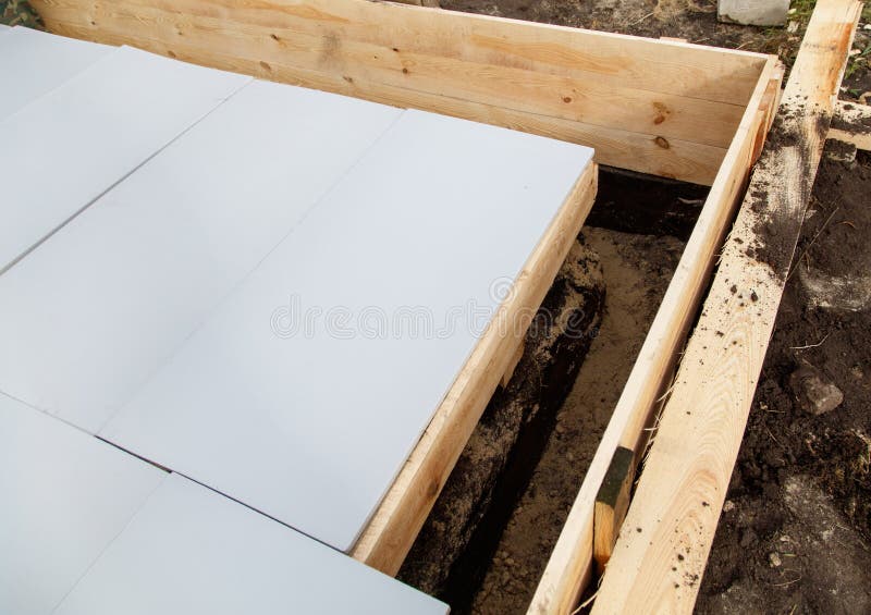 A Wooden Structure with a White Base and a Black Hole in the Middle ...