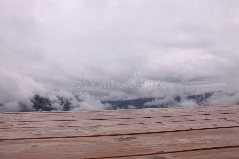 Wooden Surface and Beautiful Mountains Covered with Fog Stock Photo ...