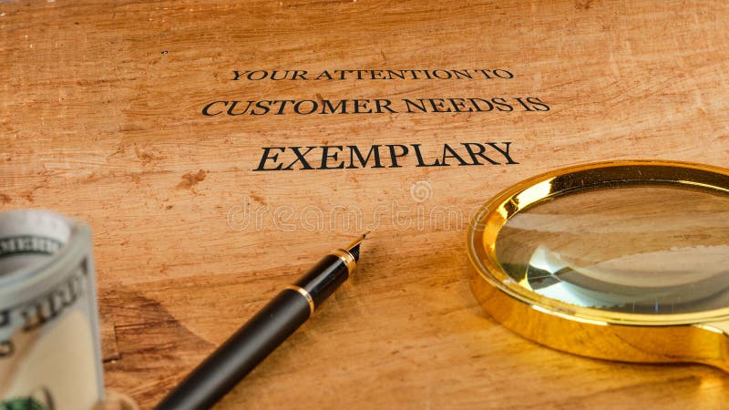 A Wooden Surface Features a Message about Outstanding Customer Service ...