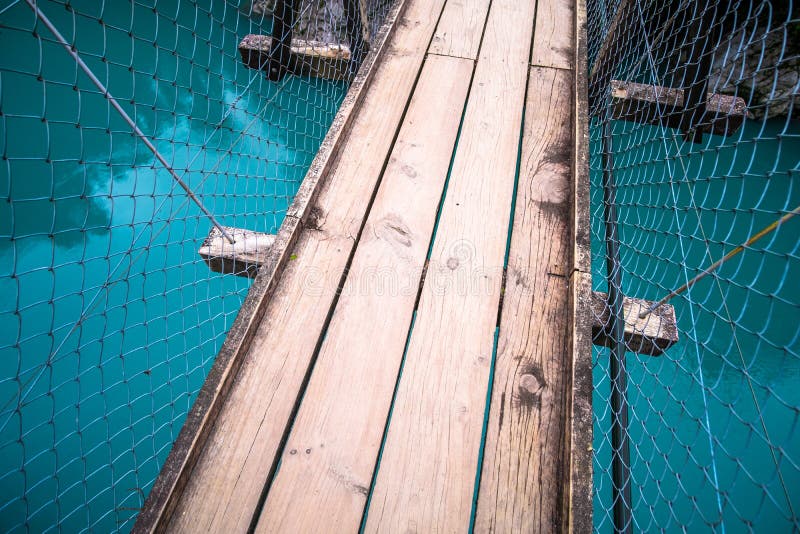 The Wooden Swing Bridge in the Green Nature Stock Image - Image of ...