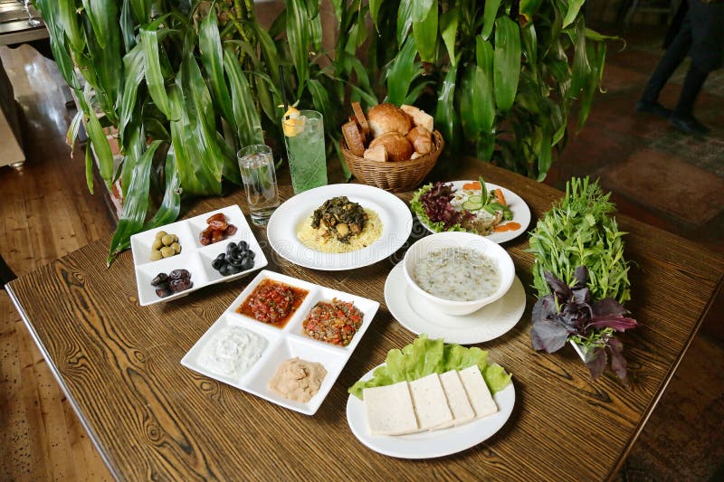 Wooden Table Adorned with Platters of Food Stock Image - Image of ...