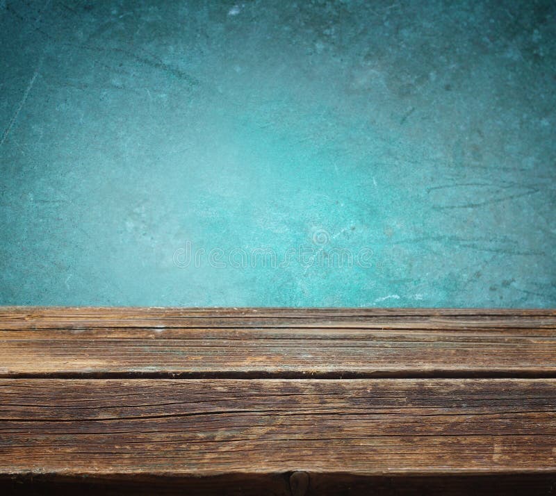 Wooden Table Against Blue Textured Background Stock Photo - Image of ...