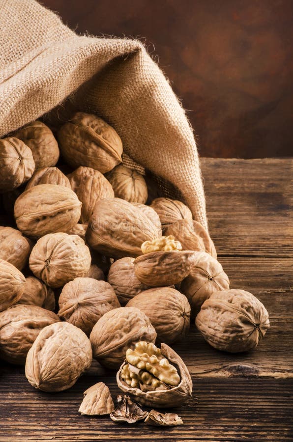 On the Wooden Table a Bag with Walnuts Stock Photo - Image of sack ...