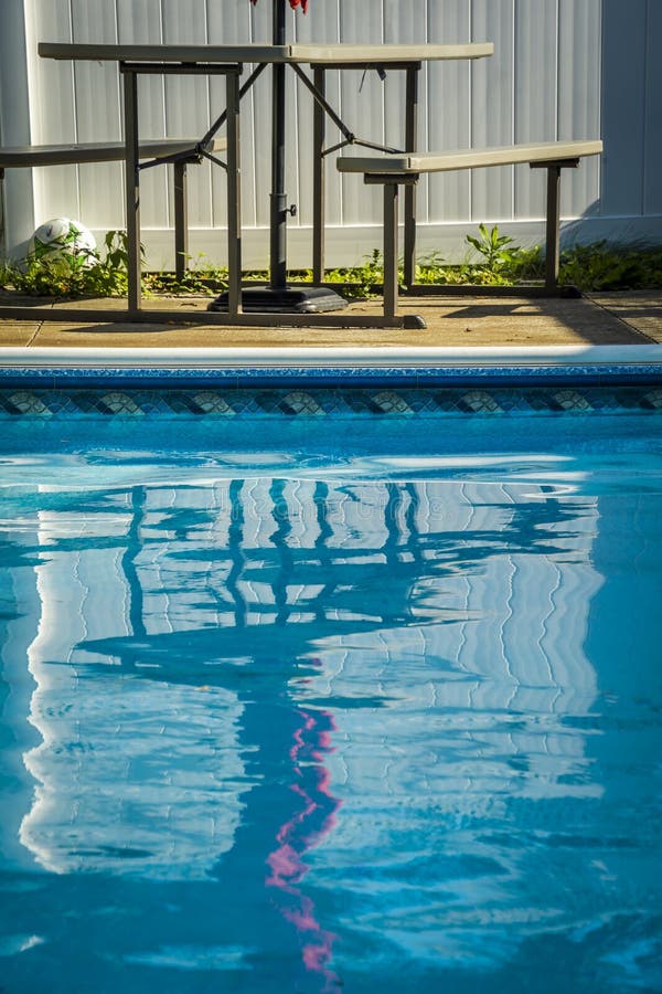 Wooden Table and Bench by a Pool Stock Photo - Image of poolside ...