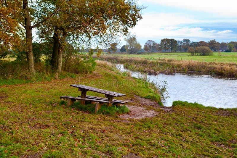 Wooden Table and Benches by River Stock Image - Image of orange, nature ...