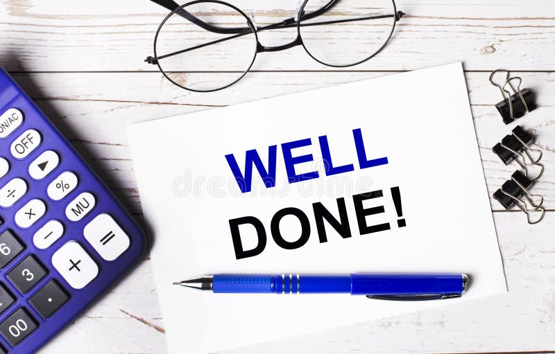 On a Wooden Table is a Blue Calculator, Paper Clips, Glasses, a Blue ...