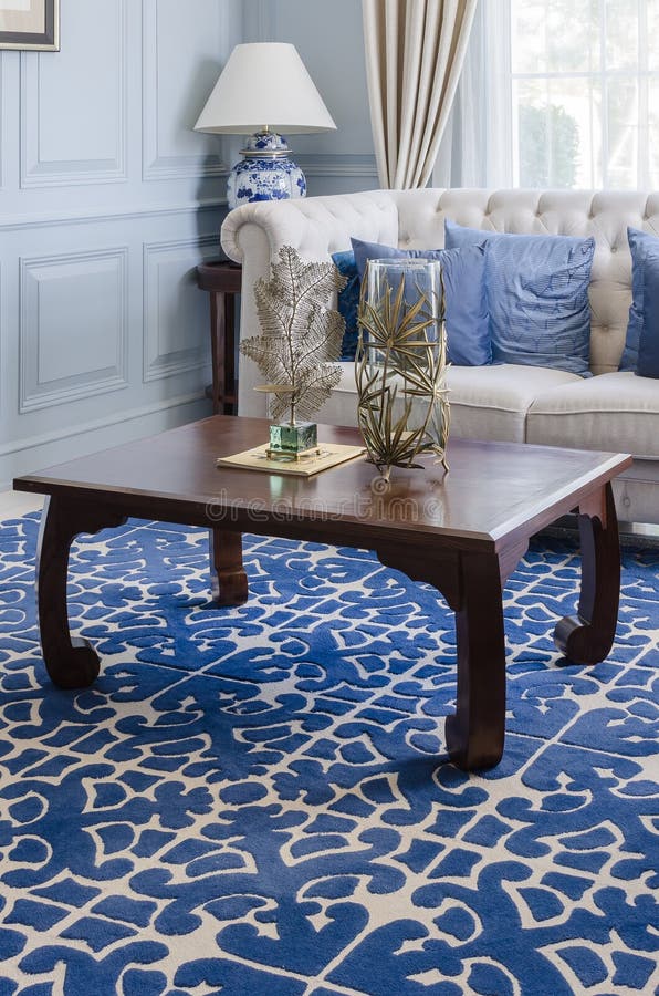 Wooden Table on Blue Pattern Carpet in Luxury Living Room Stock Photo ...