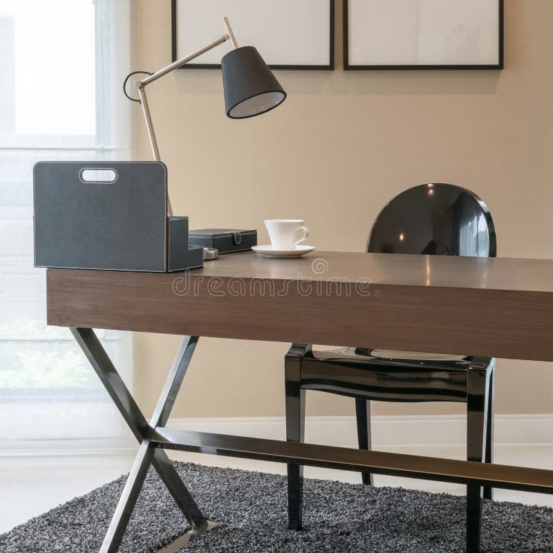 Wooden Table and Books in Modern Working Room Interior Stock Photo ...