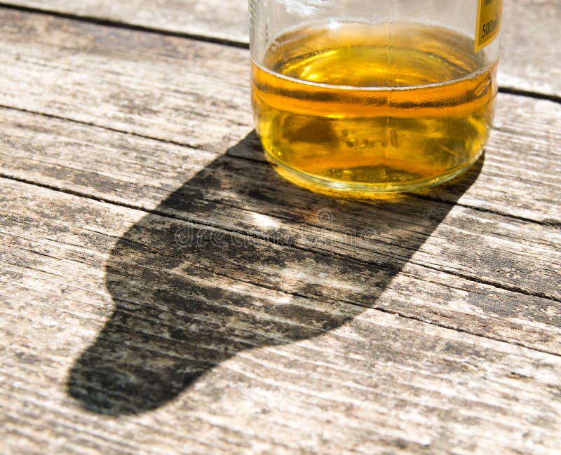 Bottom of Alcoholic Bottle Under the Sun Stock Image - Image of cafe ...