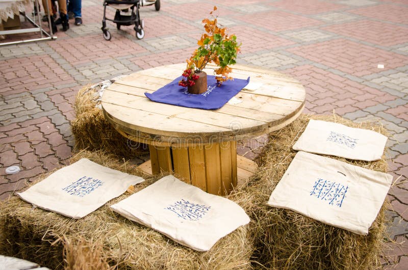 Wooden Table and Chairs Decorated with Sheaves of Straw in a Rustic ...